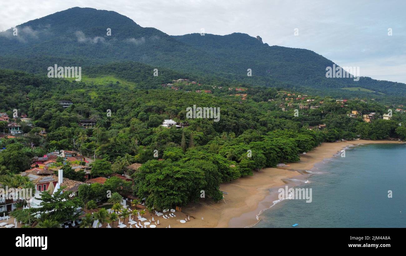 An aerial view of the forested area and sandy beach in Brazil Stock ...