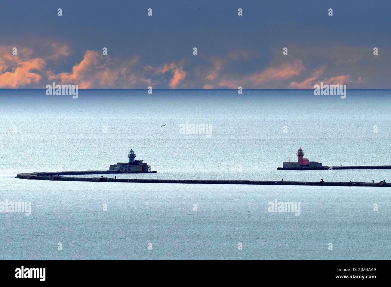 A two lighthouses at the bottom of the sea with a cloudy sky on the ...