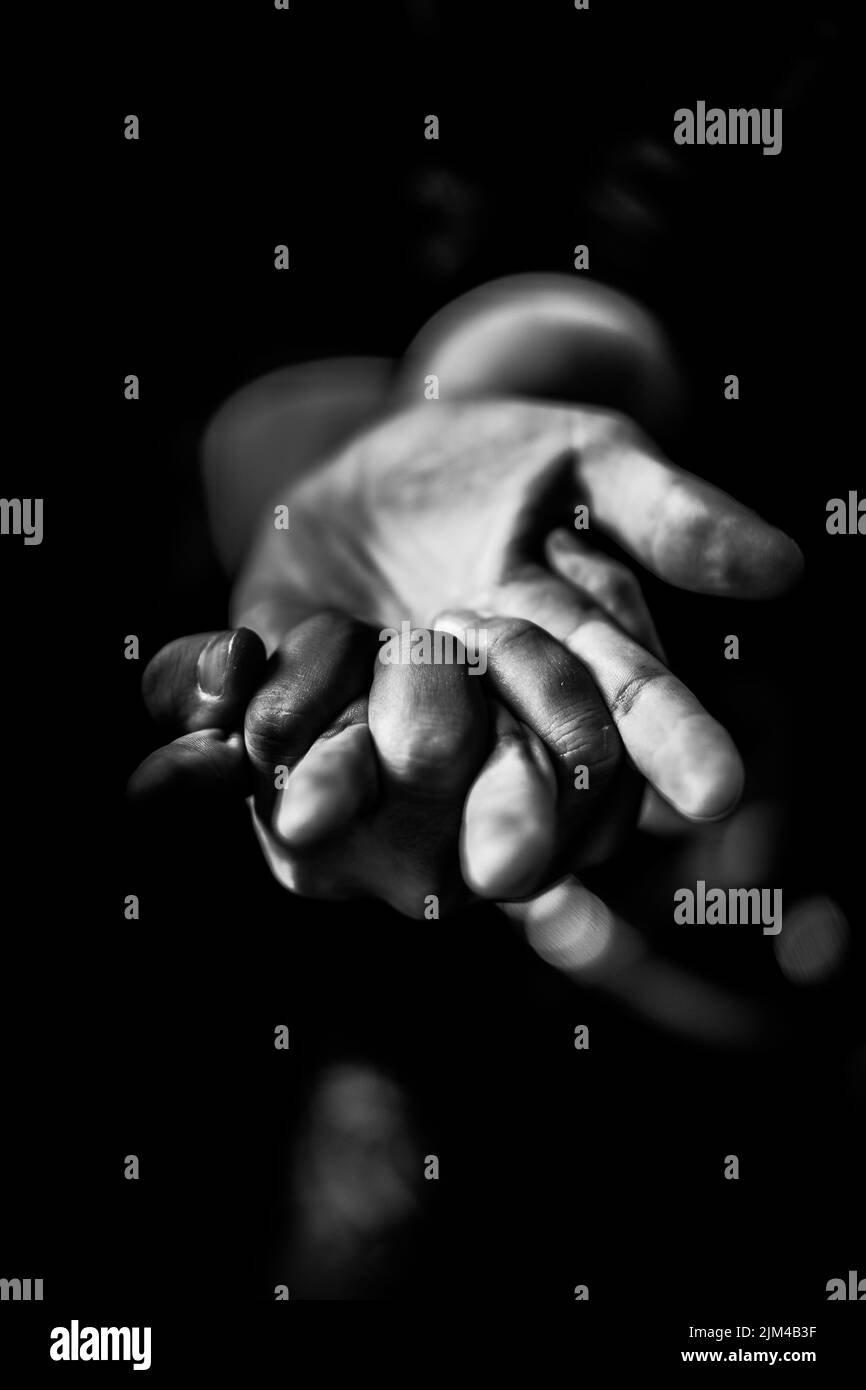 Outstretched hands Black and White Stock Photos & Images - Alamy