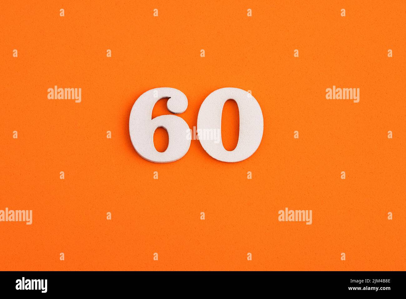 White wooden number 60 on eva rubber orange background Stock Photo - Alamy