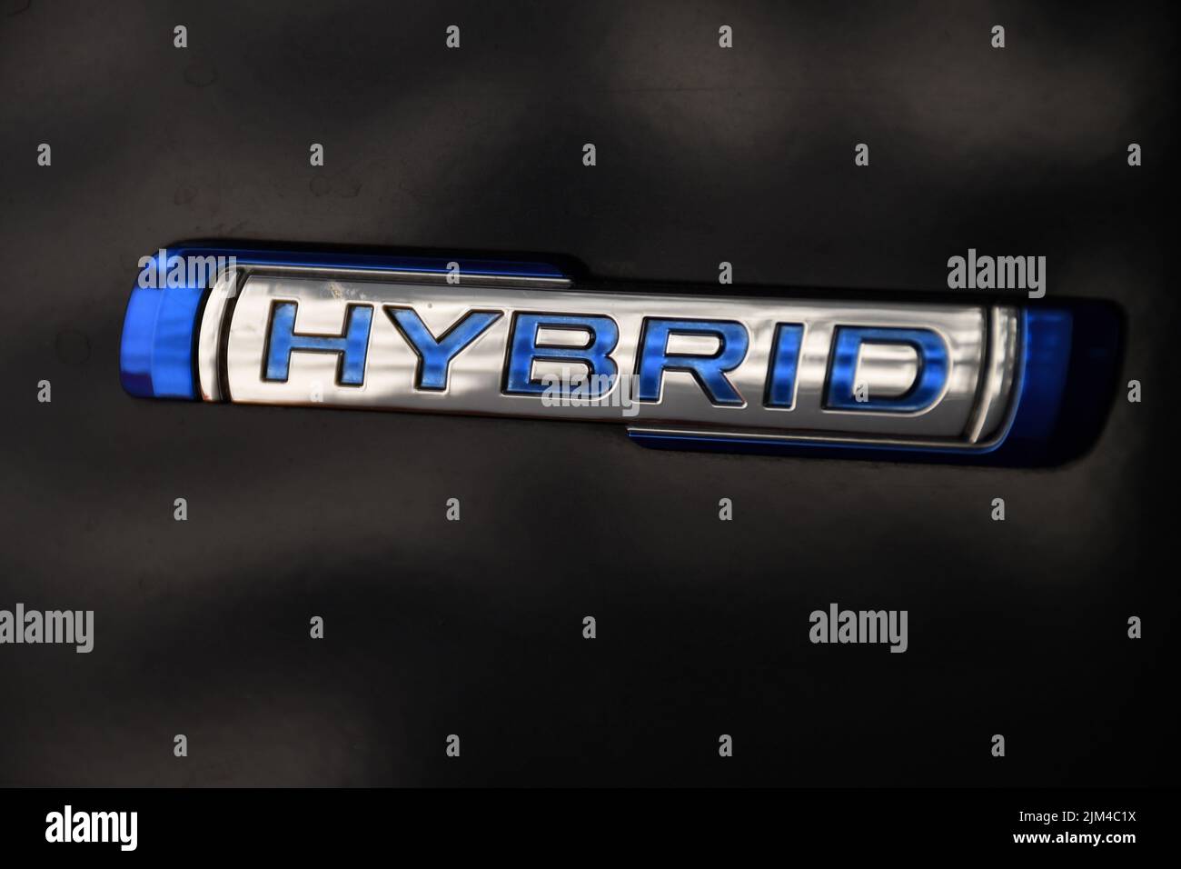 A closeup of a hybrid logo for cars Stock Photo - Alamy