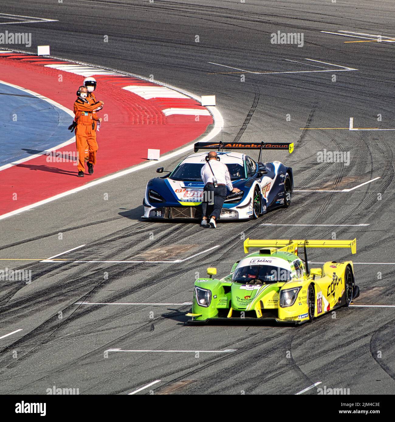 A closeup of sports cars on track during motor Sports at the Dubai ...