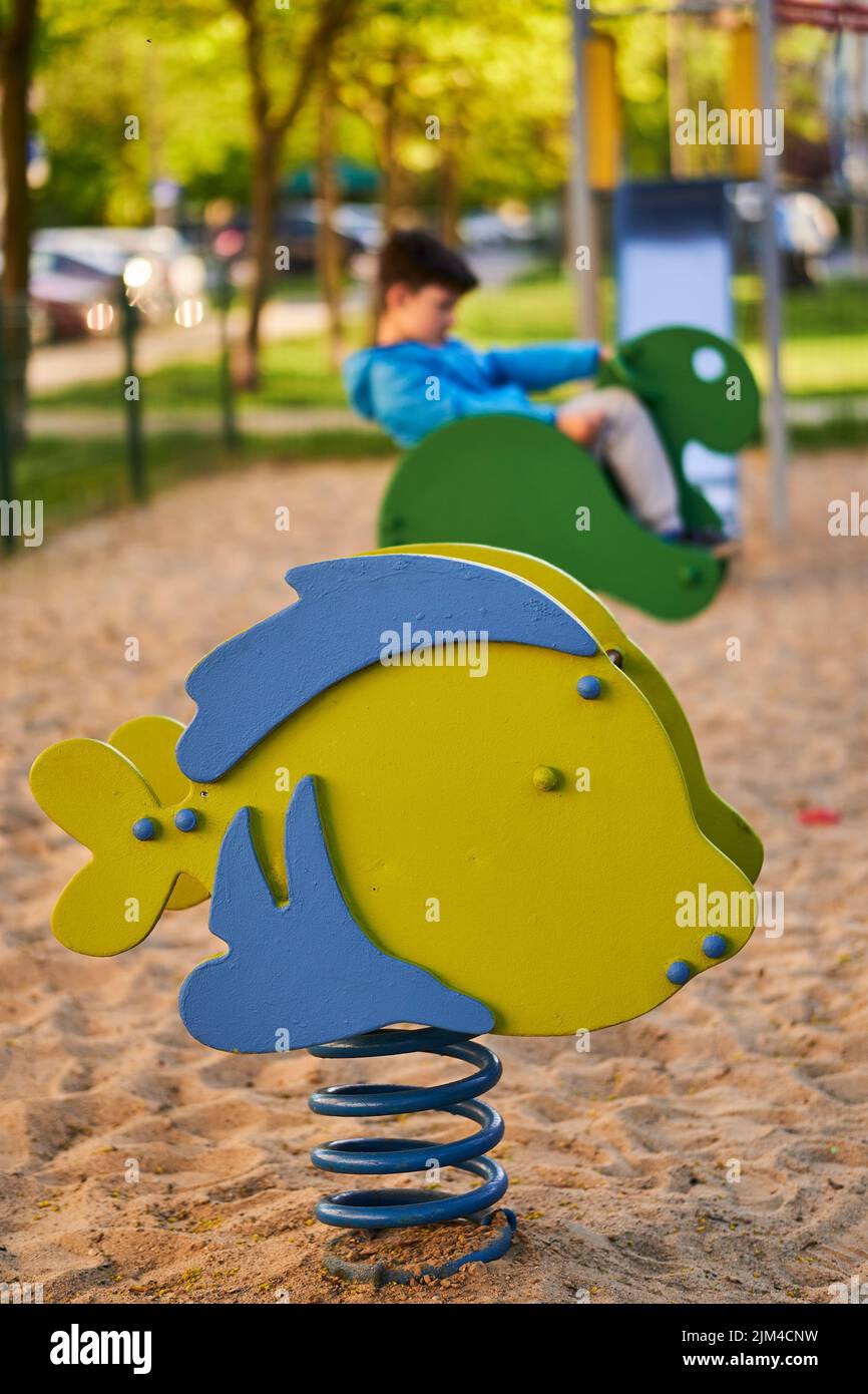 The fish-shaped wooden swing equipment at a playground in the Stare ...