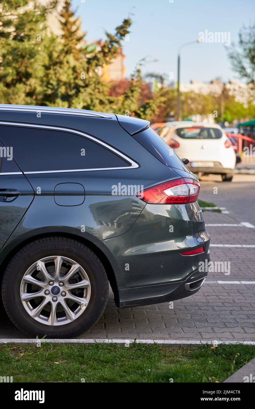 A vertical shot of a parked car in a parking place in the Stare Zegrze ...