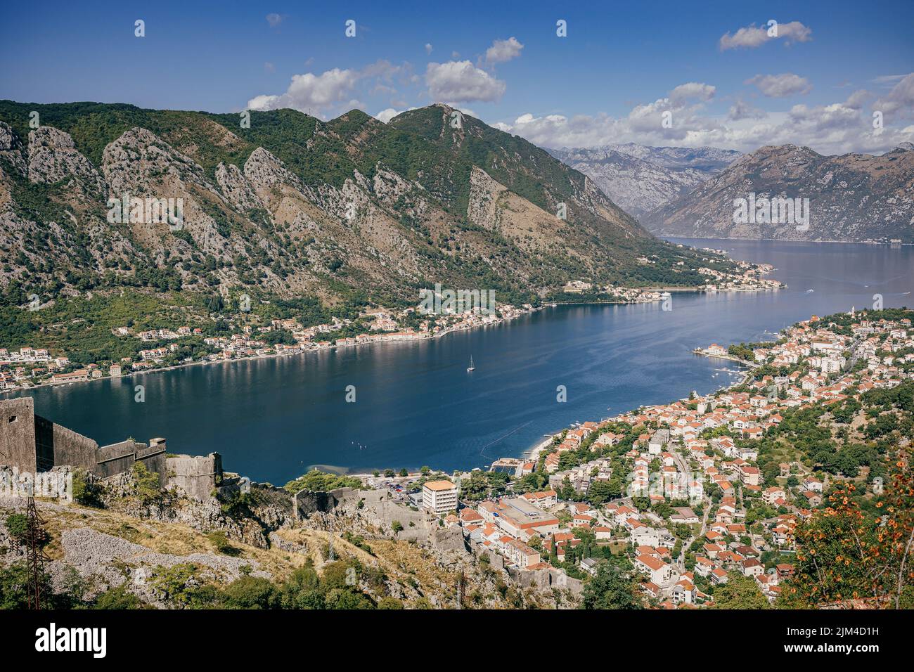 A beautiful scenery of a town with water and mountains in the ...