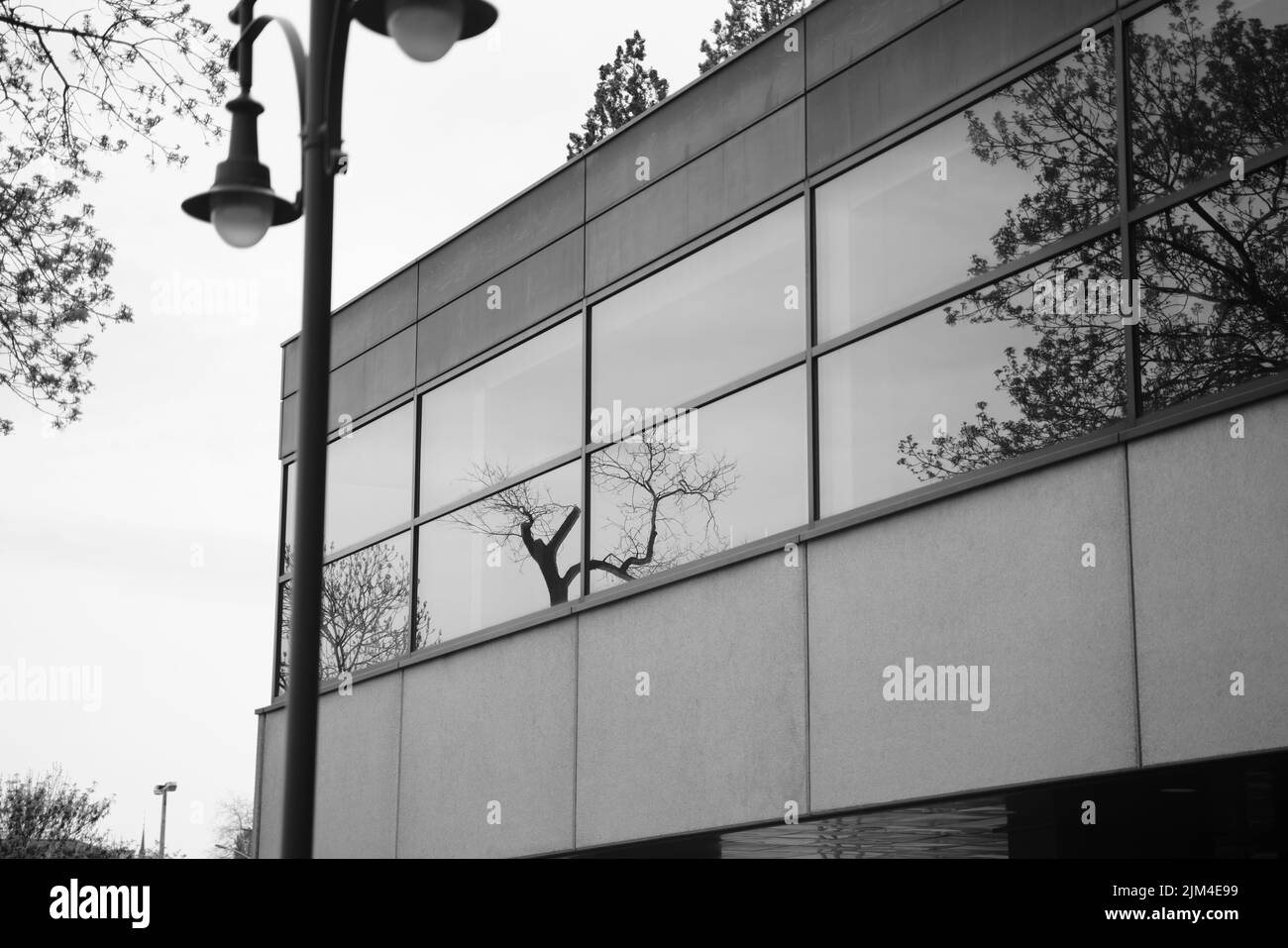 A closeup shot in black and white of a building with long windows Stock ...