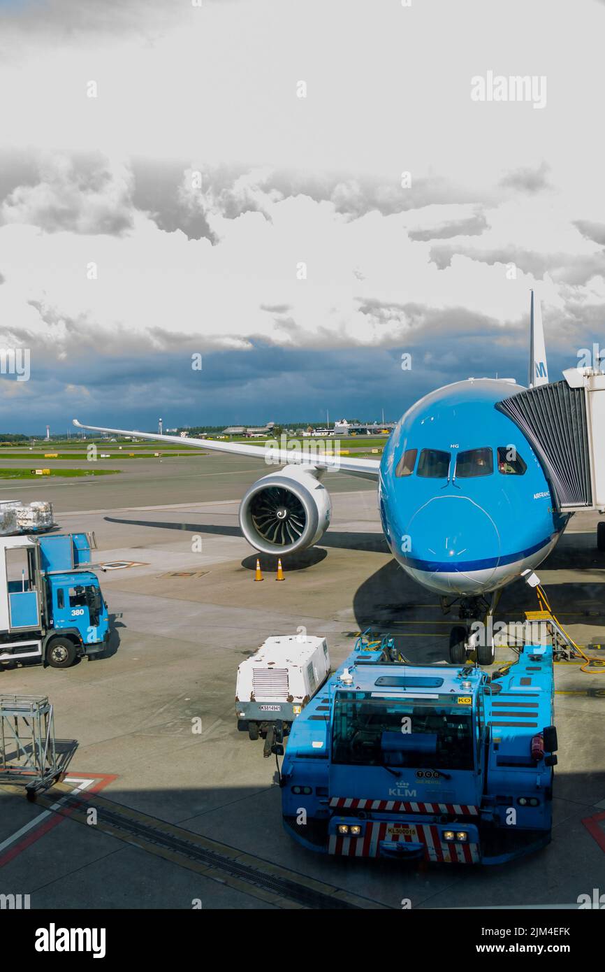 Aircraft docking at airport terminal gate, baggage loading ready for ...