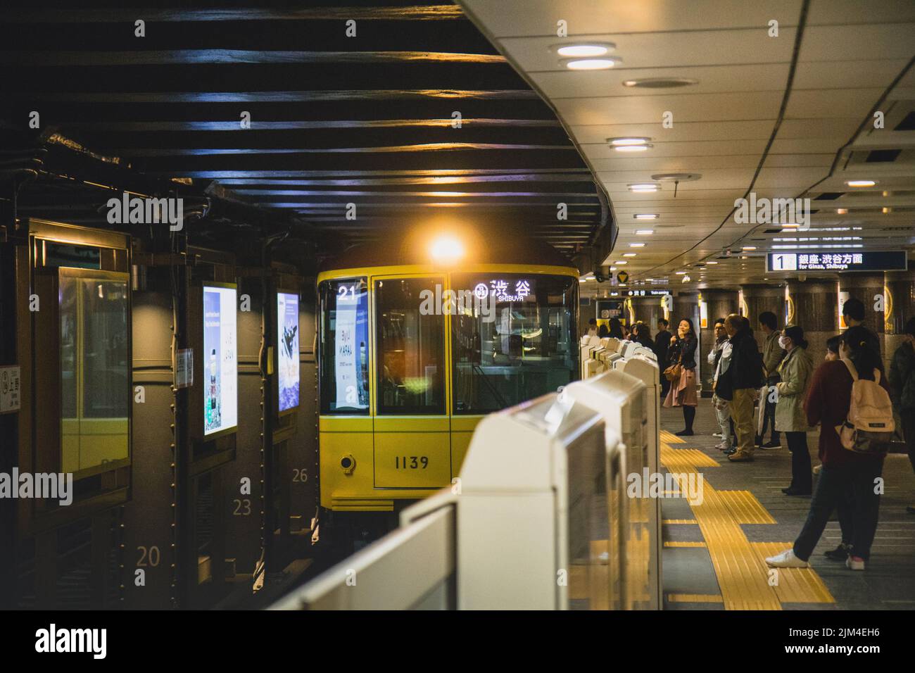 A Japanese underground train station with a train in Tokyo, Japan Stock ...