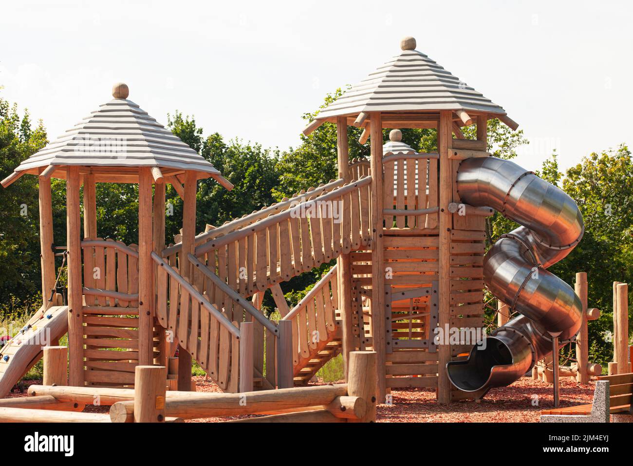 Modern children's playground for outdoor games, a slide pipe made of ...