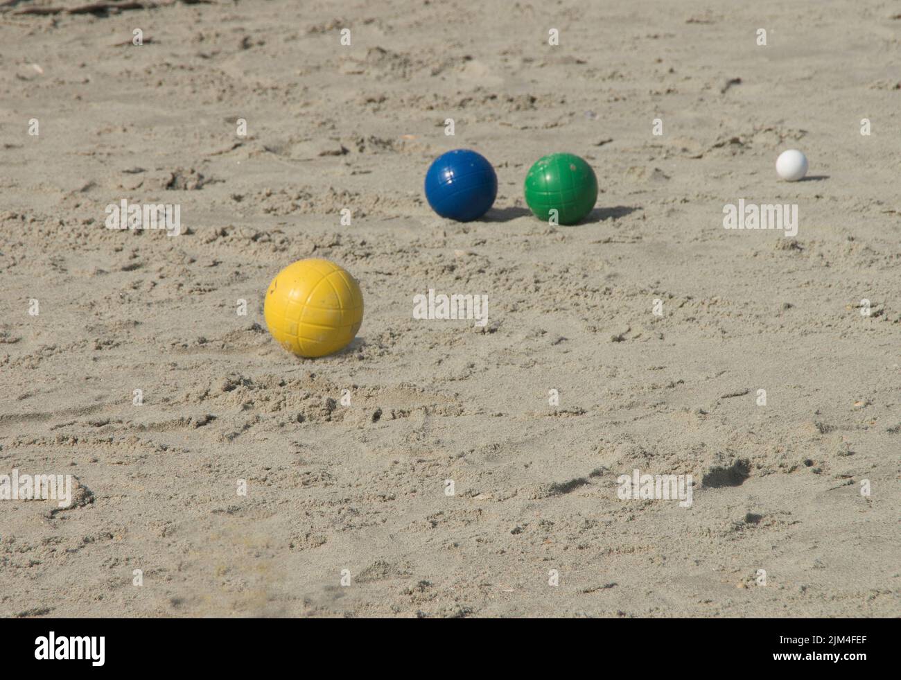A closeup of balls laying on the sand near a campground in Myrtle Beach ...
