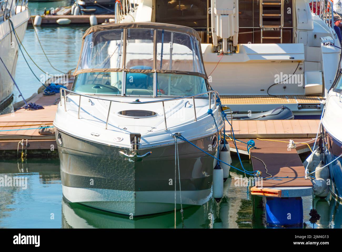 Yacht cutter boat on the pier in the sea bay Stock Photo - Alamy