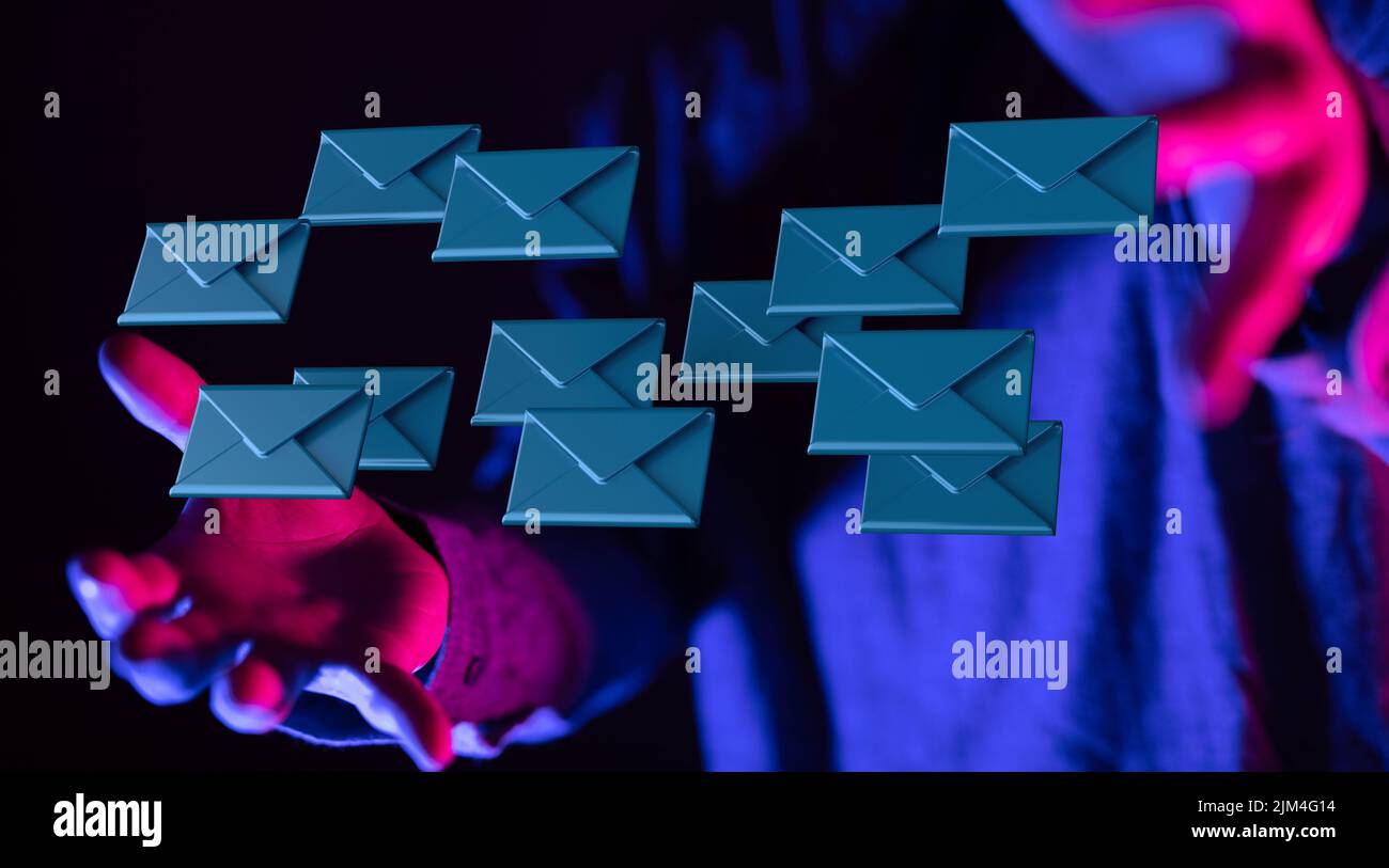 A close-up shot of a man holding multiple message symbols Stock Photo ...