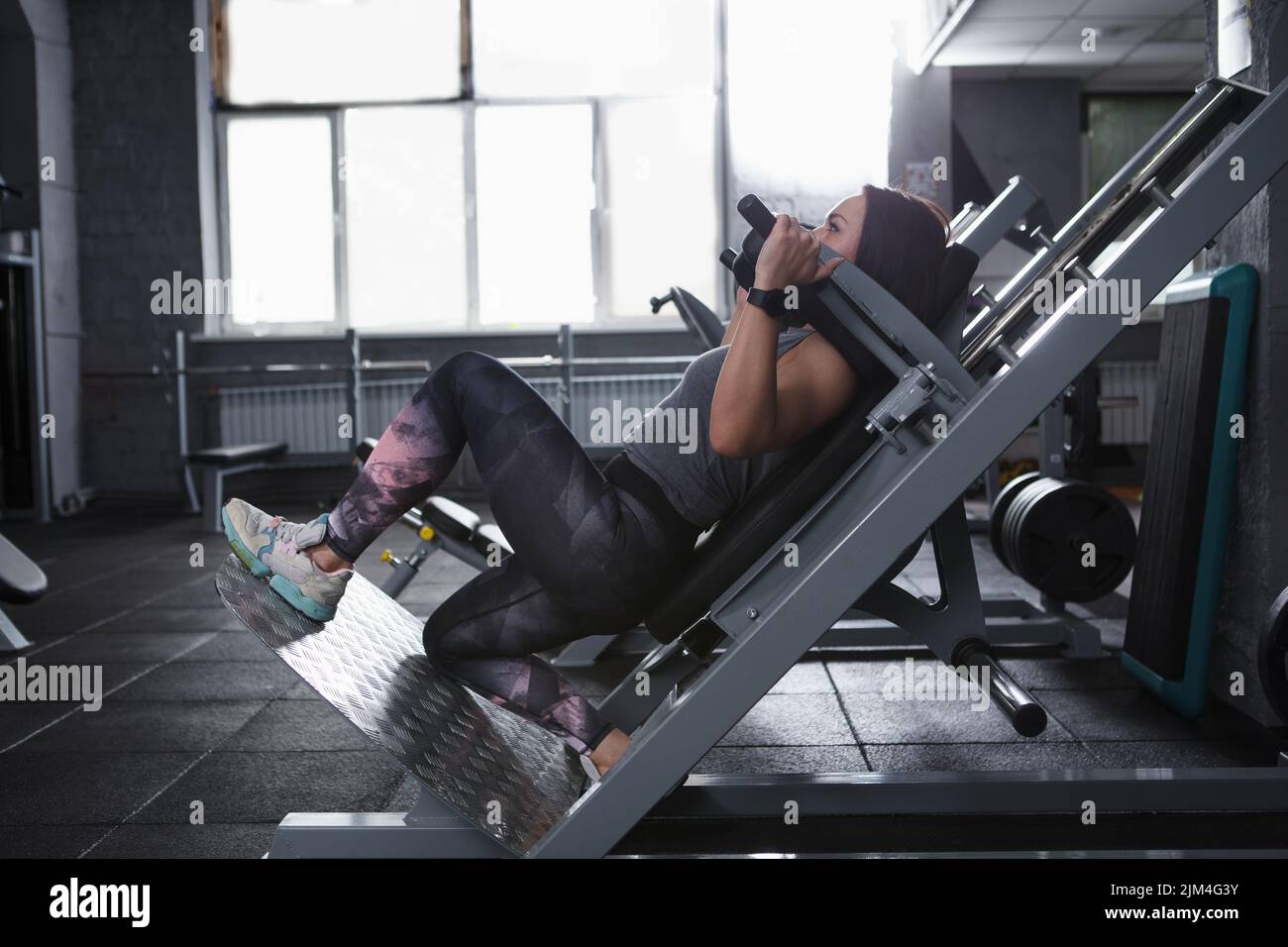Woman doing hack squats hi-res stock photography and images - Alamy