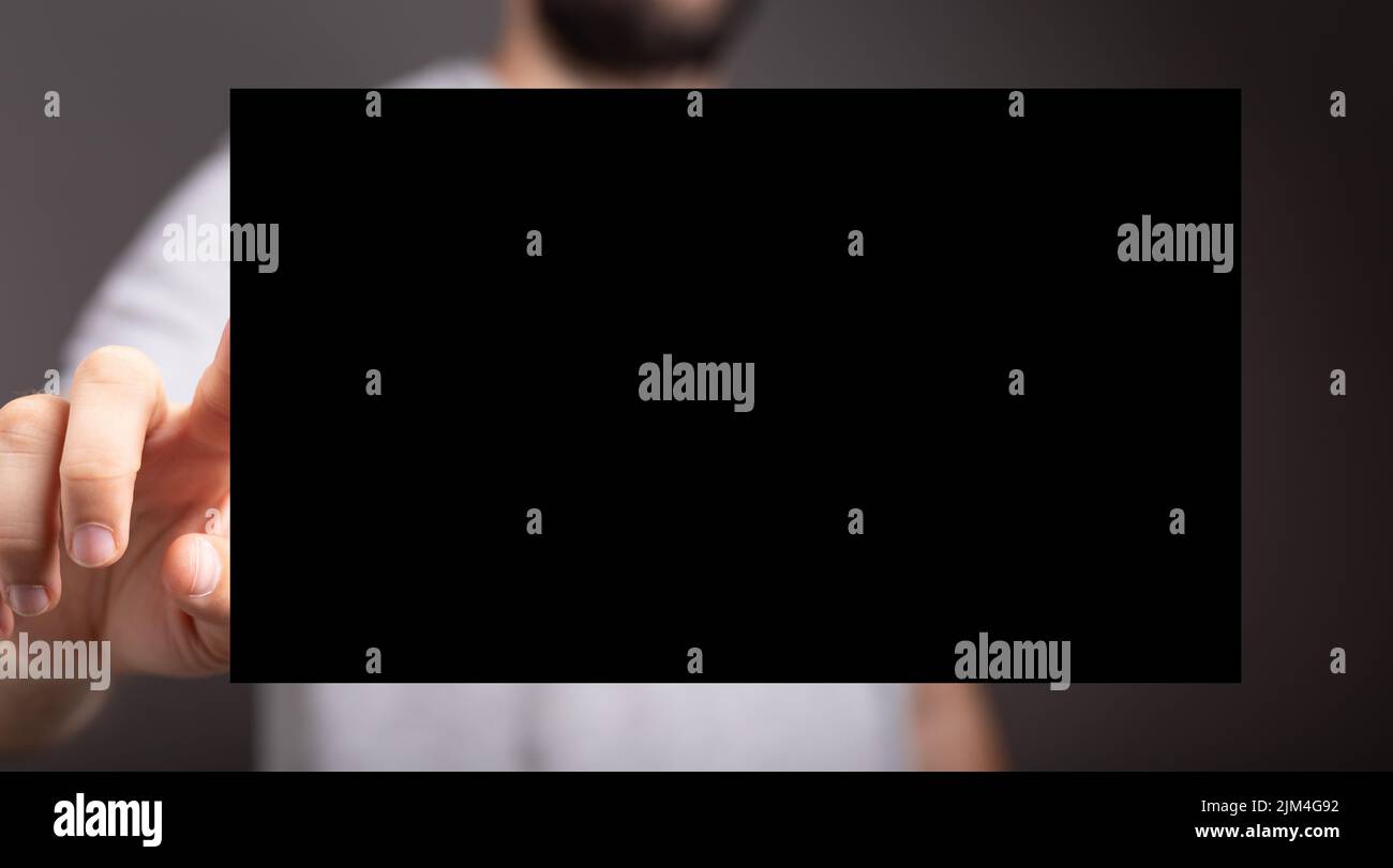 A male pointing at a blank black space - perfect for your content Stock ...