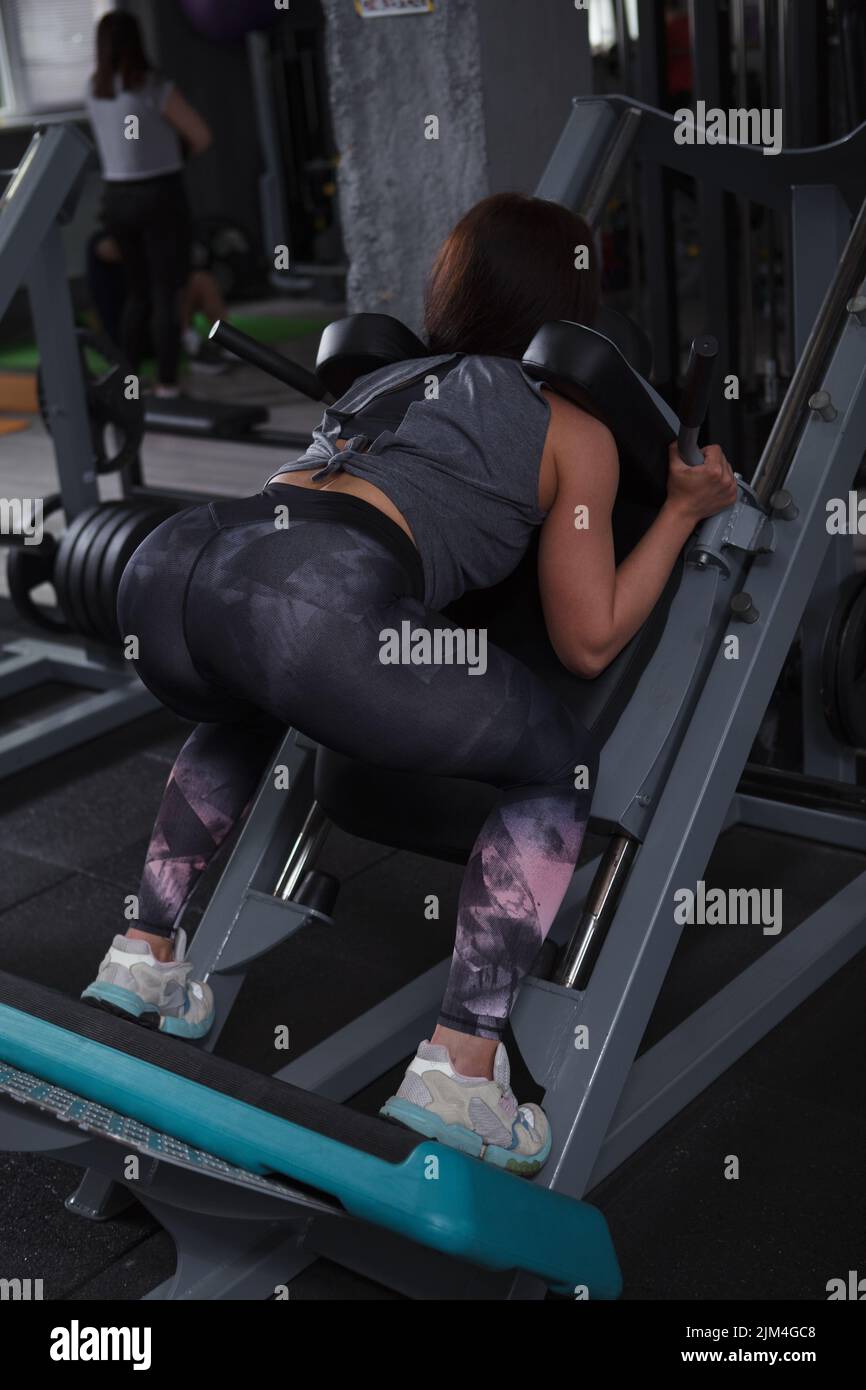 Woman squats rear view hi-res stock photography and images - Alamy