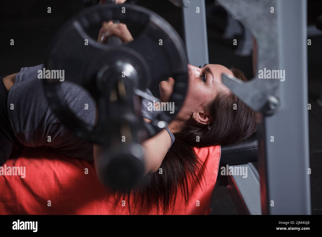 Woman doing barbell bench hi-res stock photography and images - Alamy