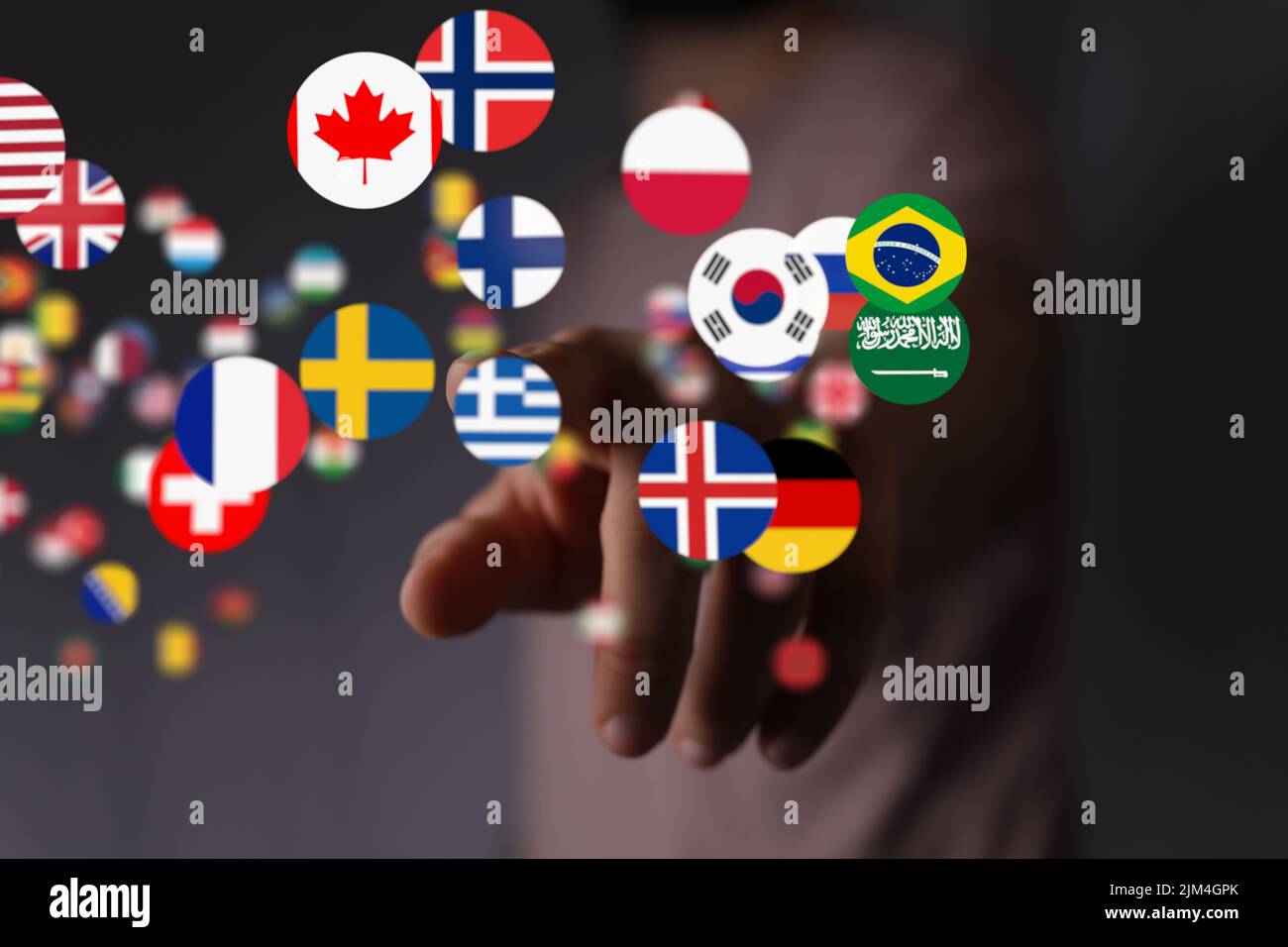 A hand pointing to the 3D rendered international world flags Stock ...