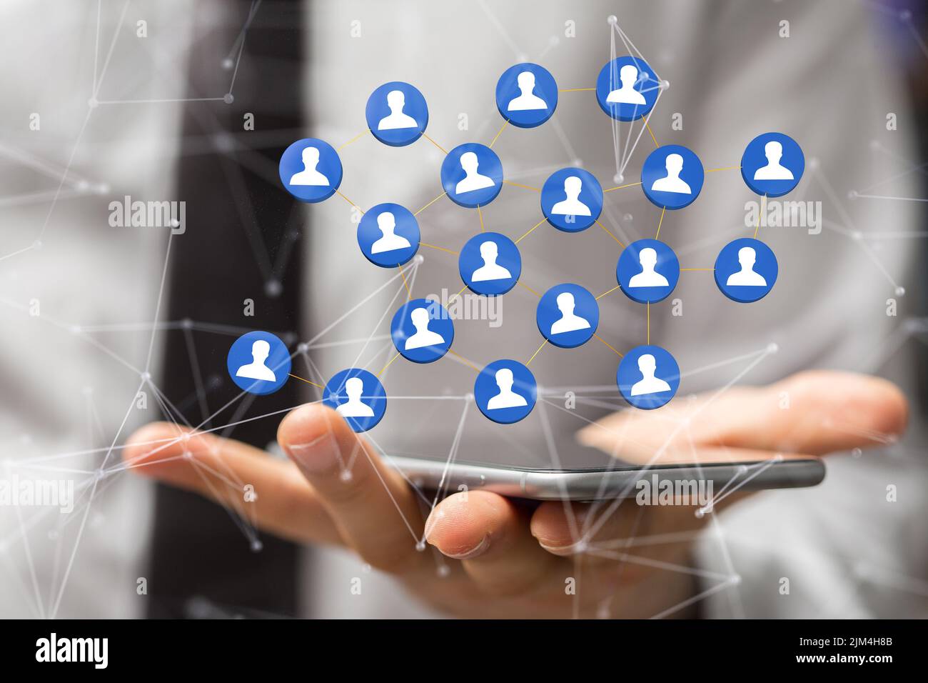 A closeup of illustrated people icons near a phone Stock Photo - Alamy