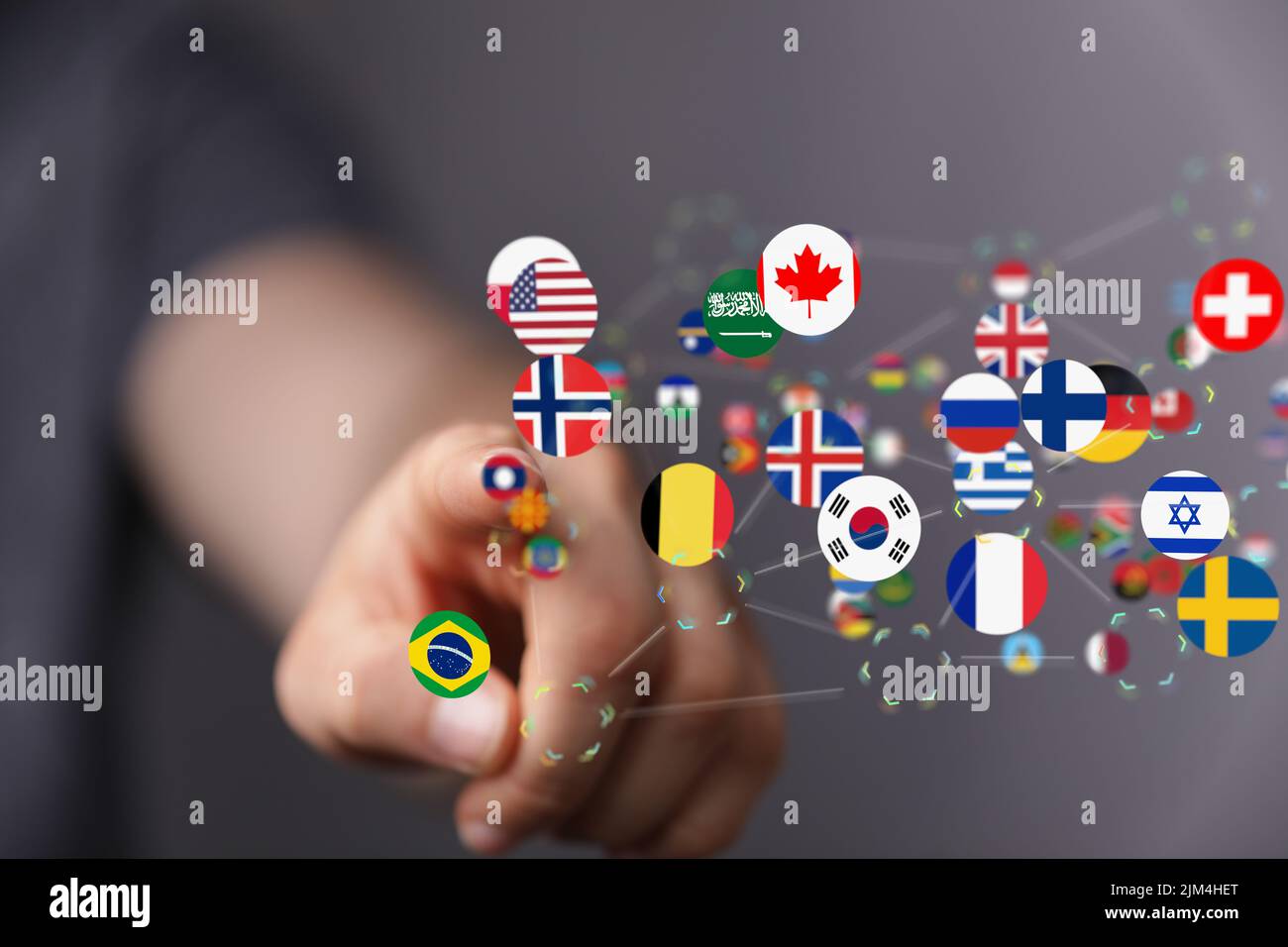 A closeup of illustrated world flags near a hand Stock Photo - Alamy