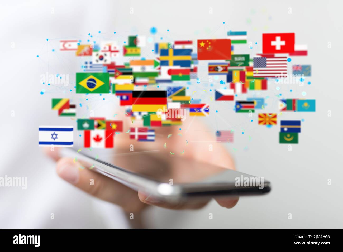 A closeup of illustrated world flags near a hand Stock Photo - Alamy