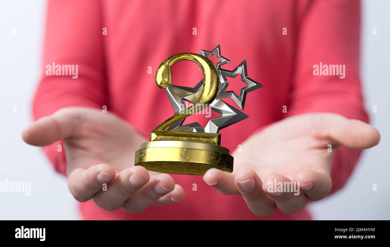 A closeup of illustrated number 2 near a hand Stock Photo - Alamy