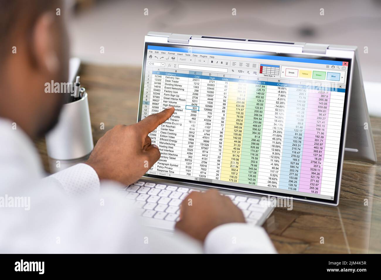 African American Analyst Using Spreadsheet On Screen Stock Photo - Alamy