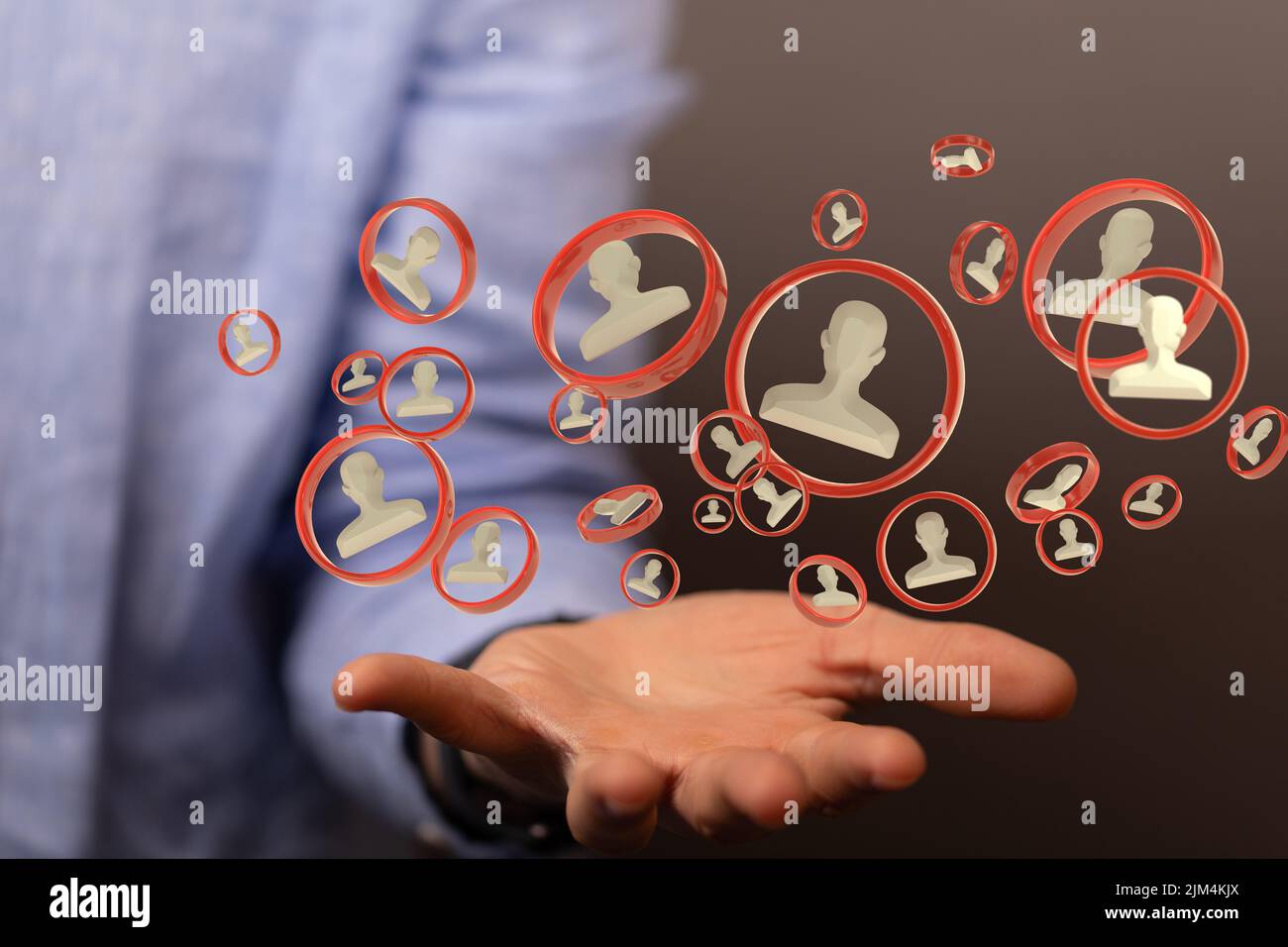 A closeup of illustrated people icons near a hand Stock Photo - Alamy