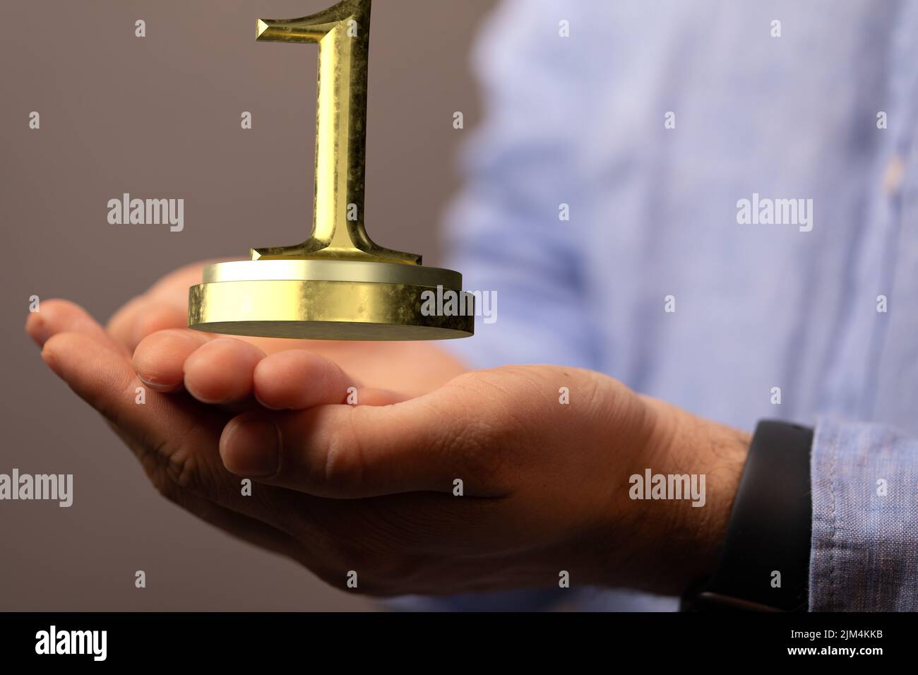 The first place awart floating in the air above person's hands Stock ...