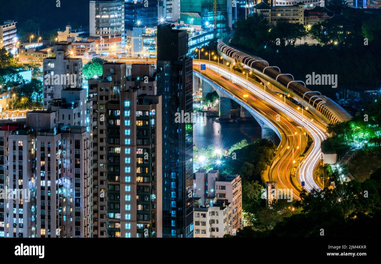 A long exposition shot of a stunning view of the night cityscape of ...