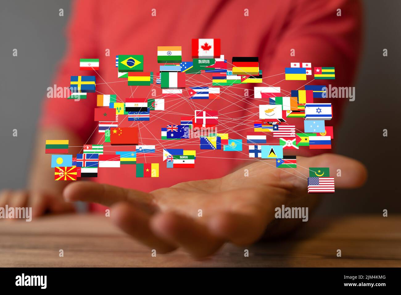 A closeup of illustrated world flags near a hand Stock Photo - Alamy