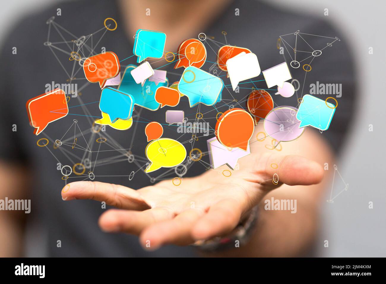 A person's hand with illustrative message icons floating above a hand ...