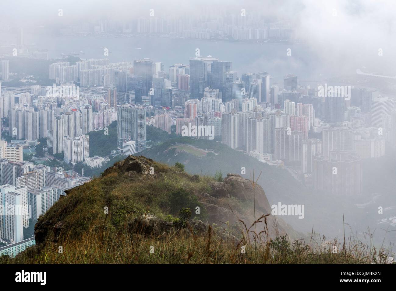 A high-angle drone shot of some high buildings in misty weather Stock ...