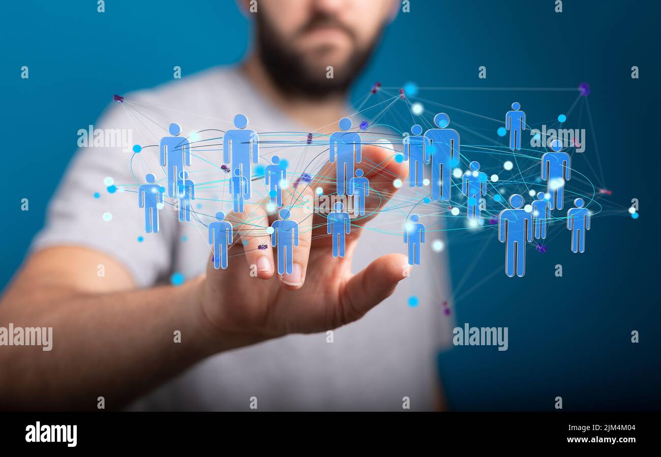 A person tapping on a 3D rendering of human icons levitating in the air ...