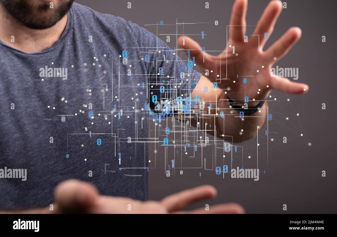 A 3D rendering of a binary code levitating in the air above a person's ...