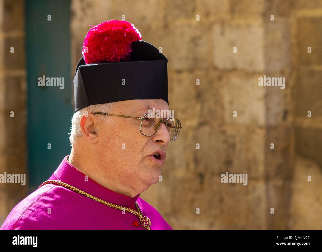 Monsignor of the Mdina Metropolitan Cathedral wearing birretum Stock ...