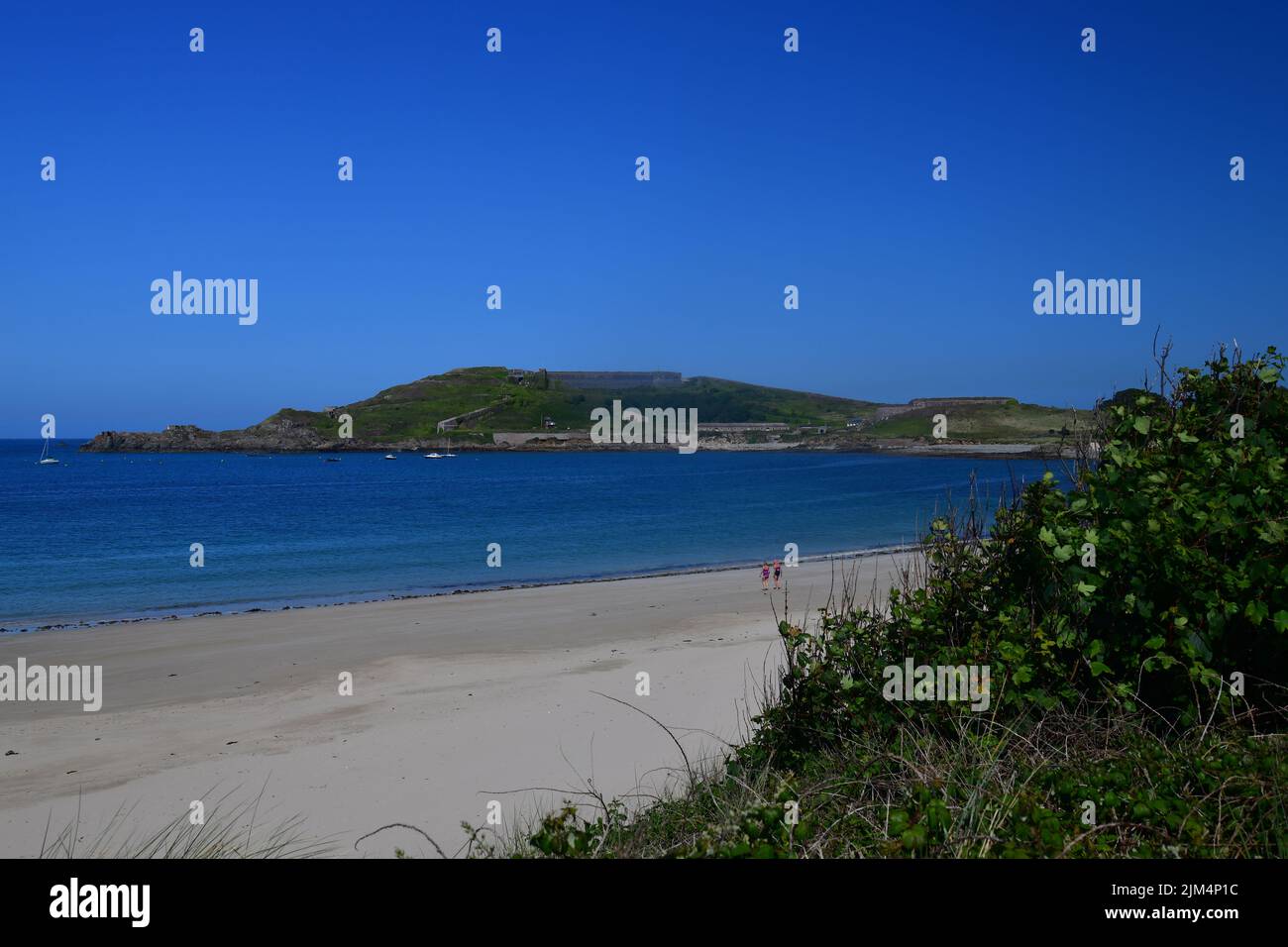 The almost white soft sand of Braye beach looking towards Fort Albert ...