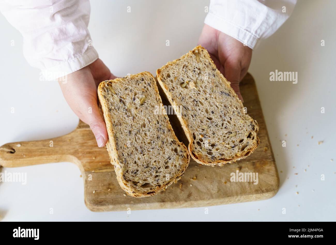 Loaf bread in womans hi-res stock photography and images - Alamy