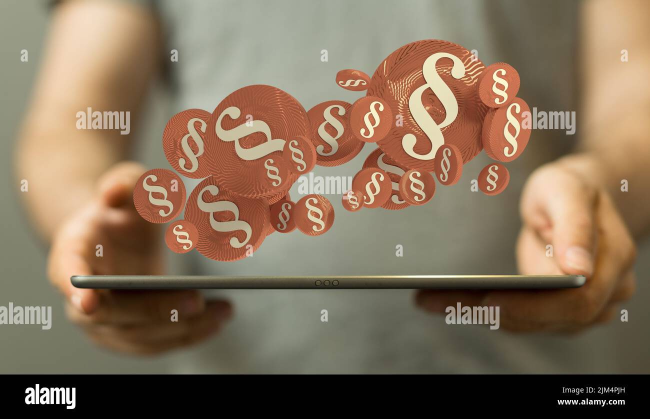 A view of brown law paragraph symbols floating over tablet holding by ...