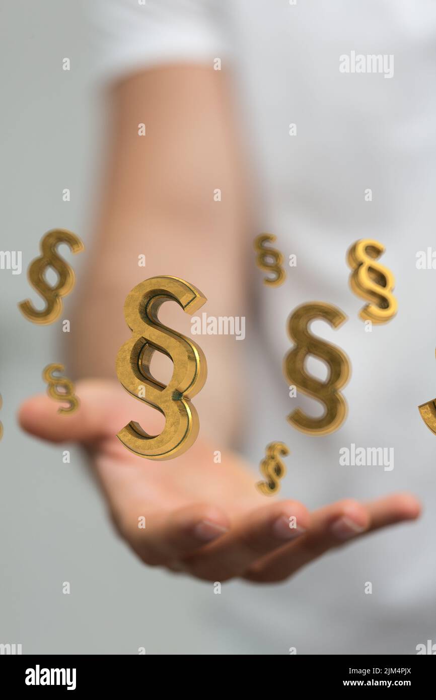 A view of golden law paragraph symbols floating in palm of male in ...