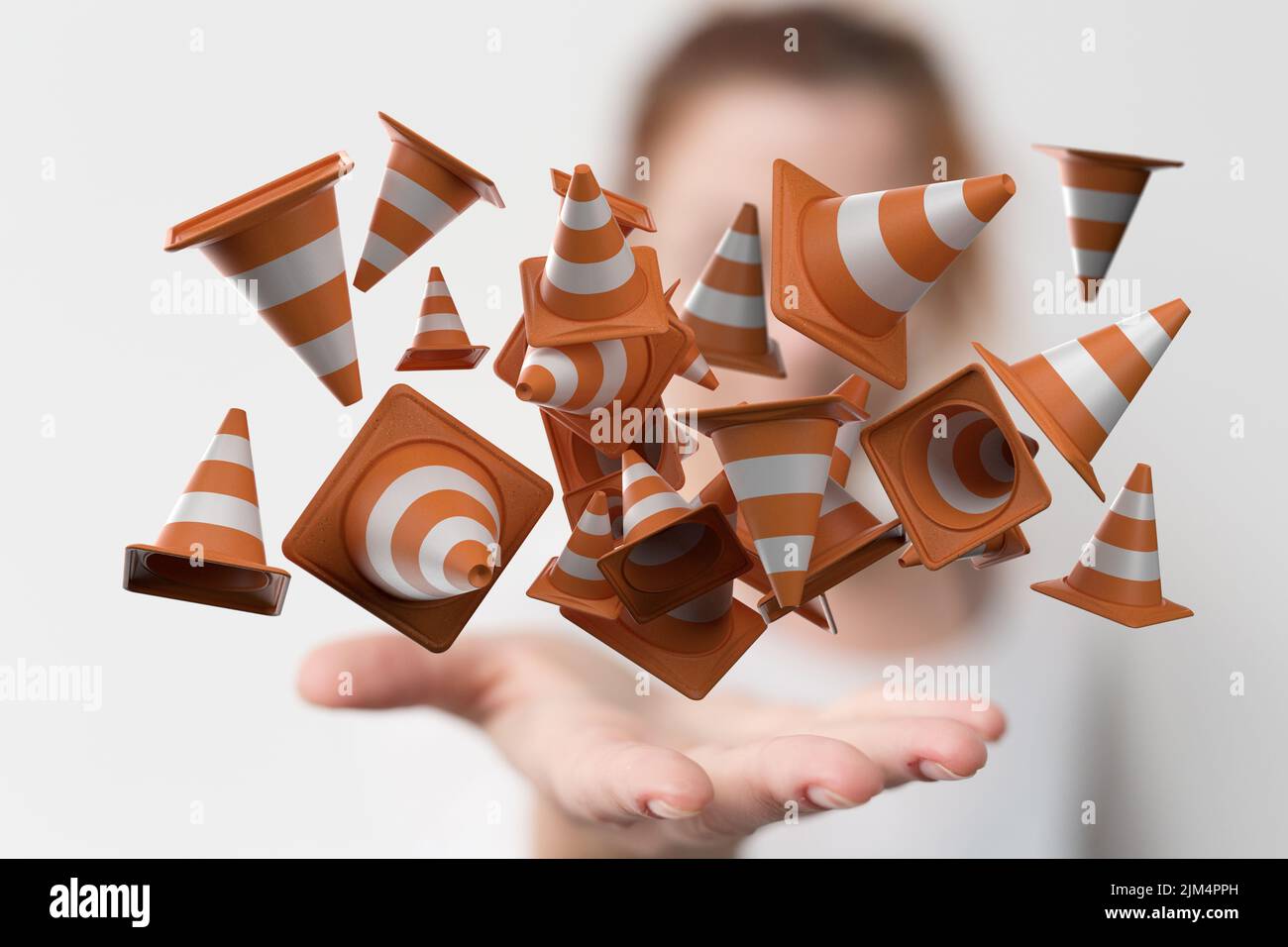 A view of orange and white traffic cone icons floating in palm of ...