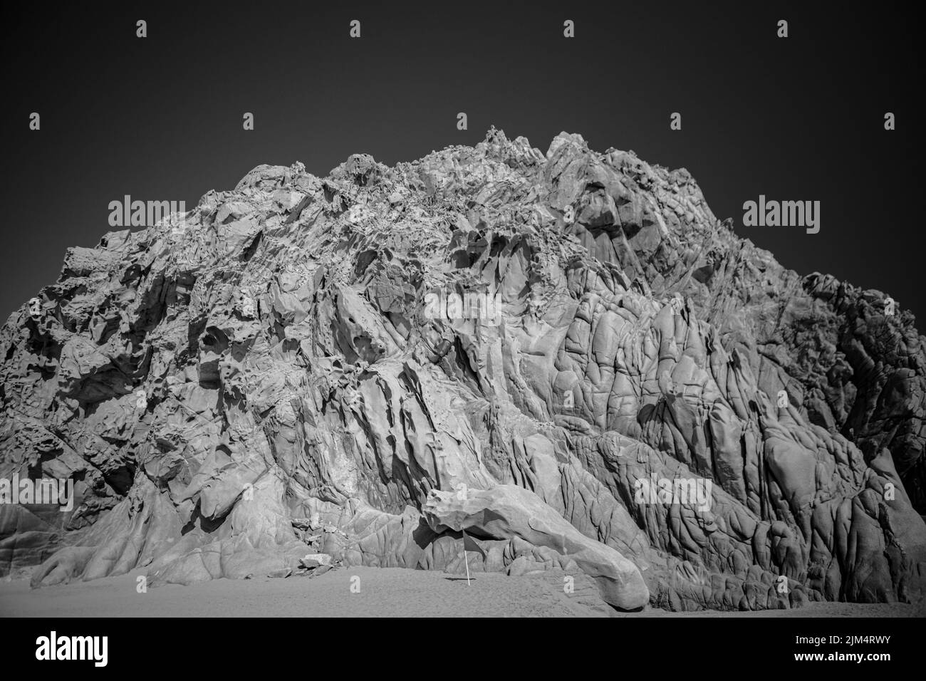 A grayscale shot of the textured cliff in the desert. Cabo, Baja ...