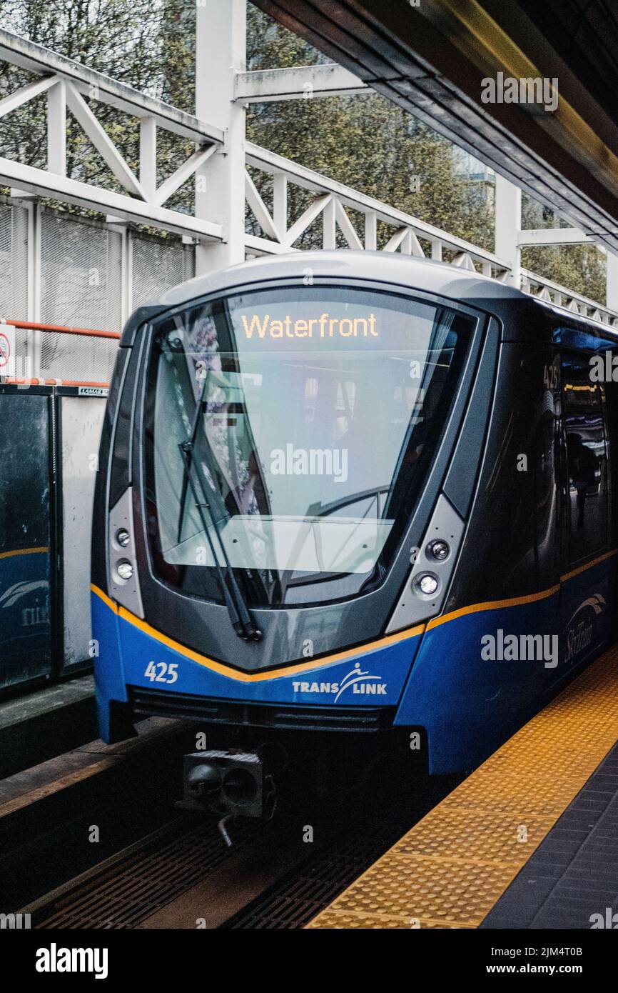 A modern Subway Train with reflecting glass on the platform in the ...
