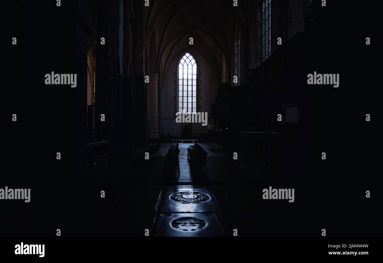 An inside view from a dark room with light coming from a window Stock ...