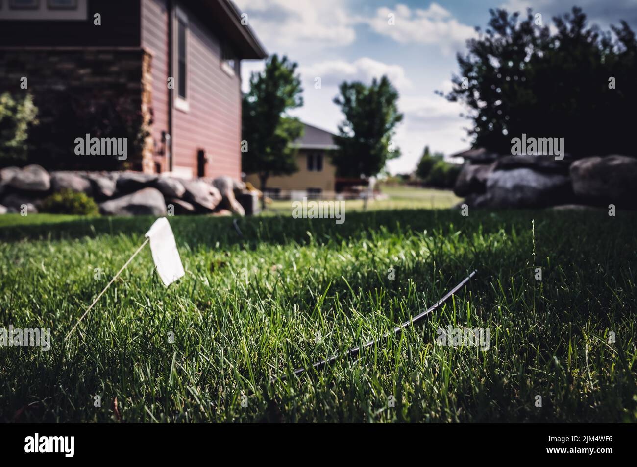 Fiber optic cable laying in the grass ready to be installed at a ...