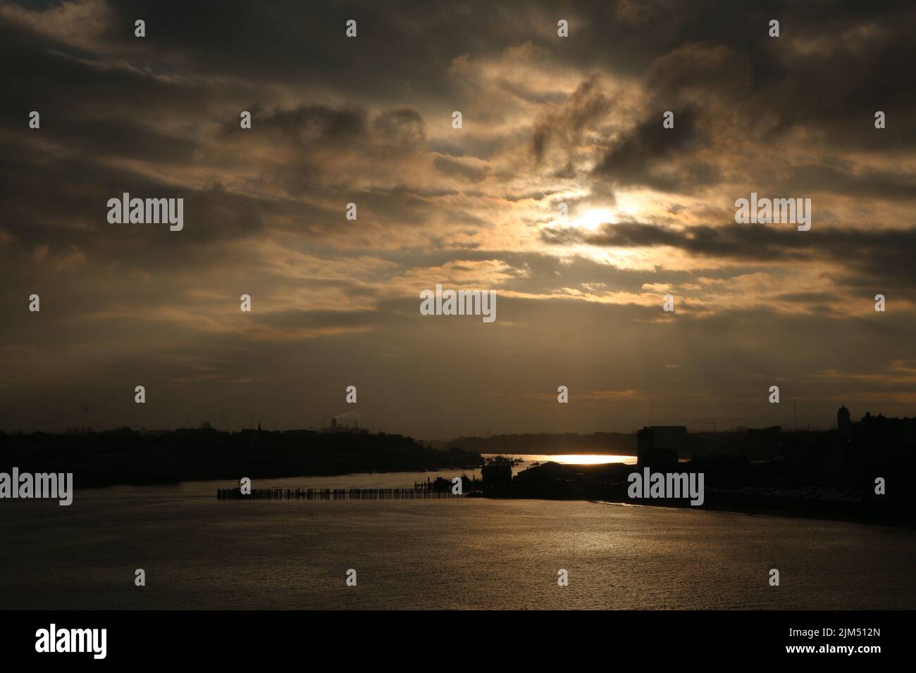 A beautiful sunset shining over the beaches of Newcastle, England ...