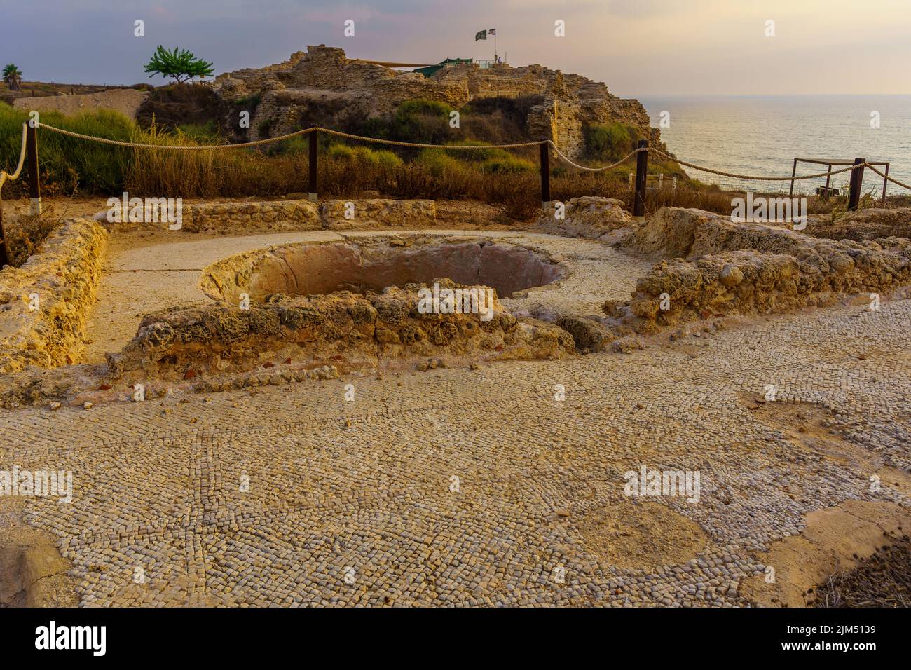 View on an ancient wine press, with a mosaic floor, and the fortress in ...