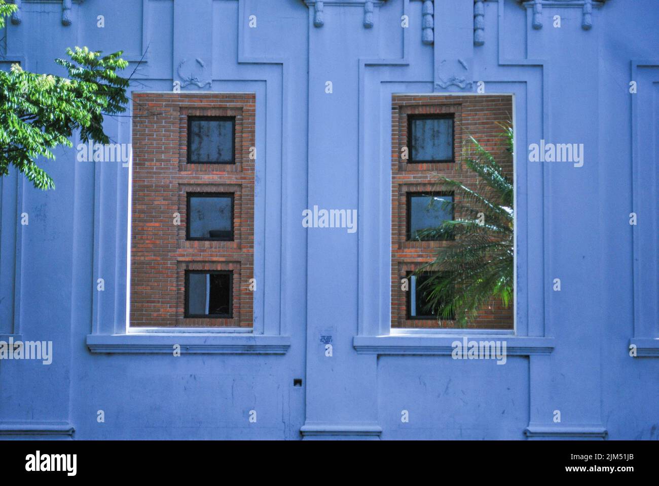 Orange brick building seen through window Stock Photo - Alamy
