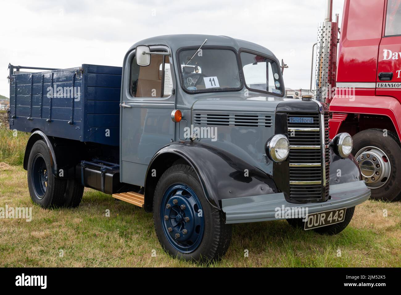 West Bay.Dorset.United Kingdom.June 12th 2022.A bedford OSBT tipper truck from 1953 is on ...