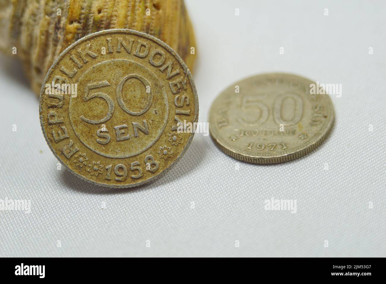 Closeup of 50 cent coins of the Republic of Indonesia on a white ...