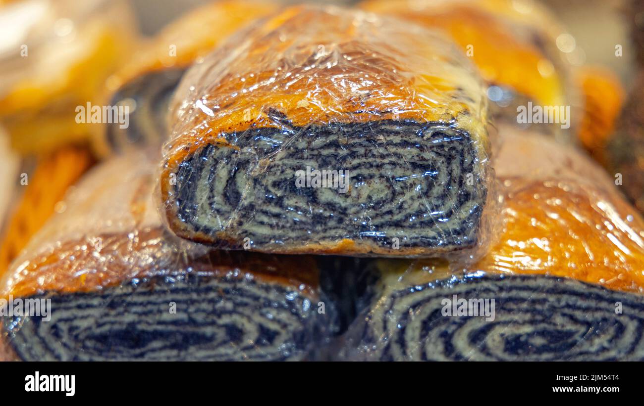 Rolls of Poppy Seed Baked Sweet Dessert in Basket Stock Photo - Alamy